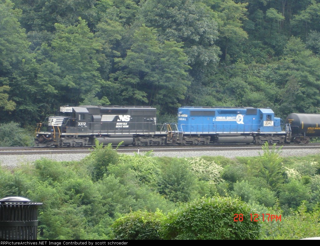 A pair of SD40-2 helpers push there way EB around the curve